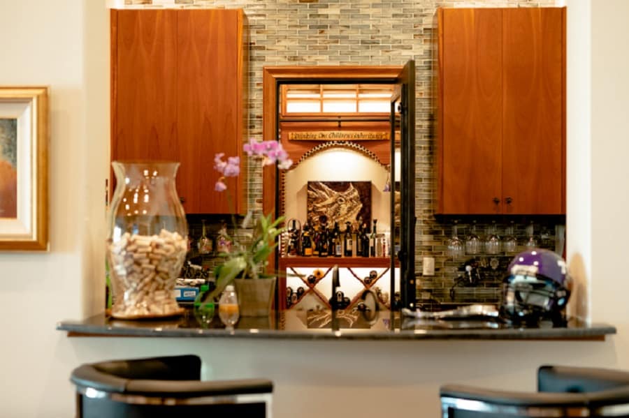Transitional Wine Cellar and Bar Area in North Dallas Home